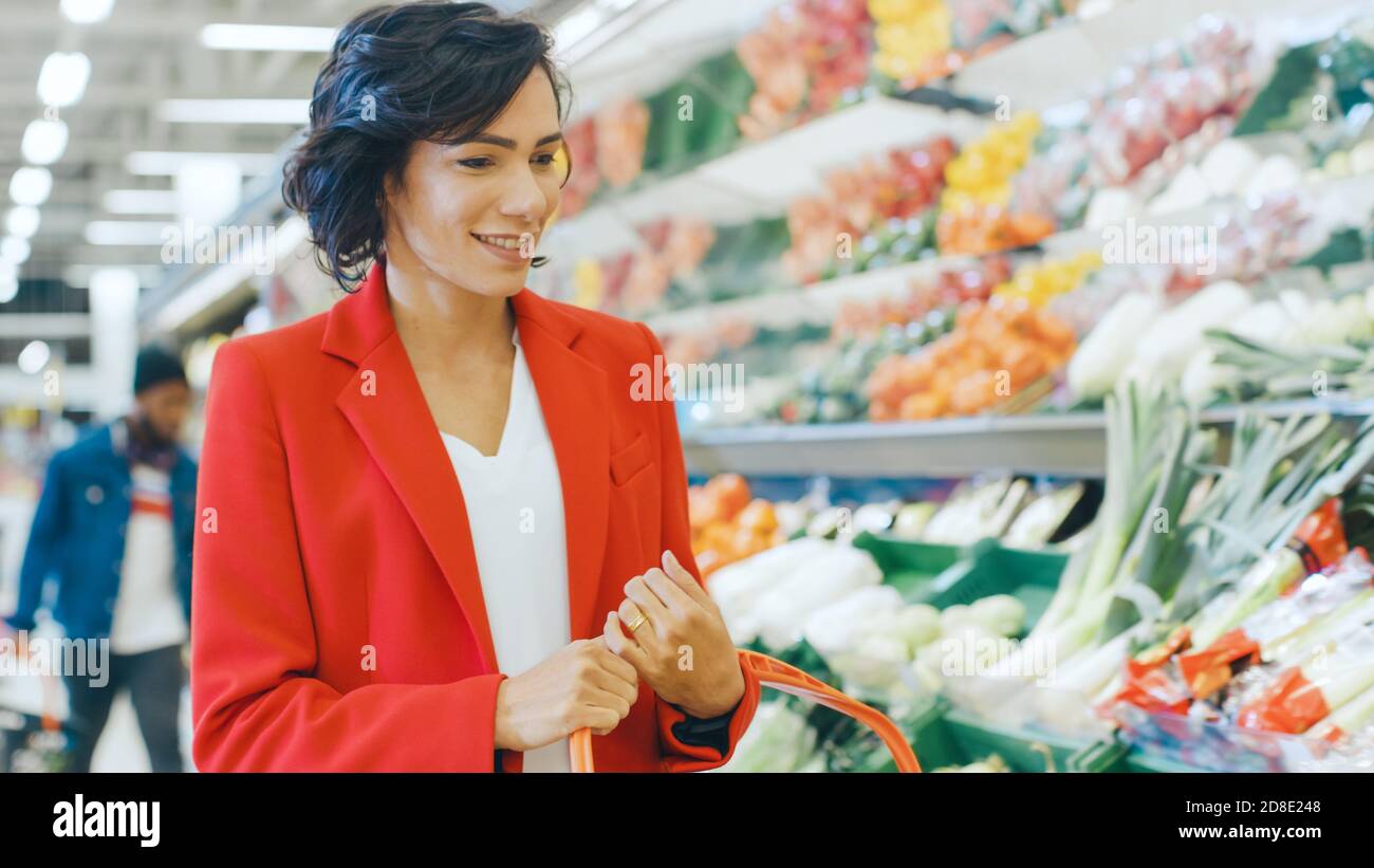 At the Supermarket: Portrait of the Beautiful Smiling Woman Choosing ...