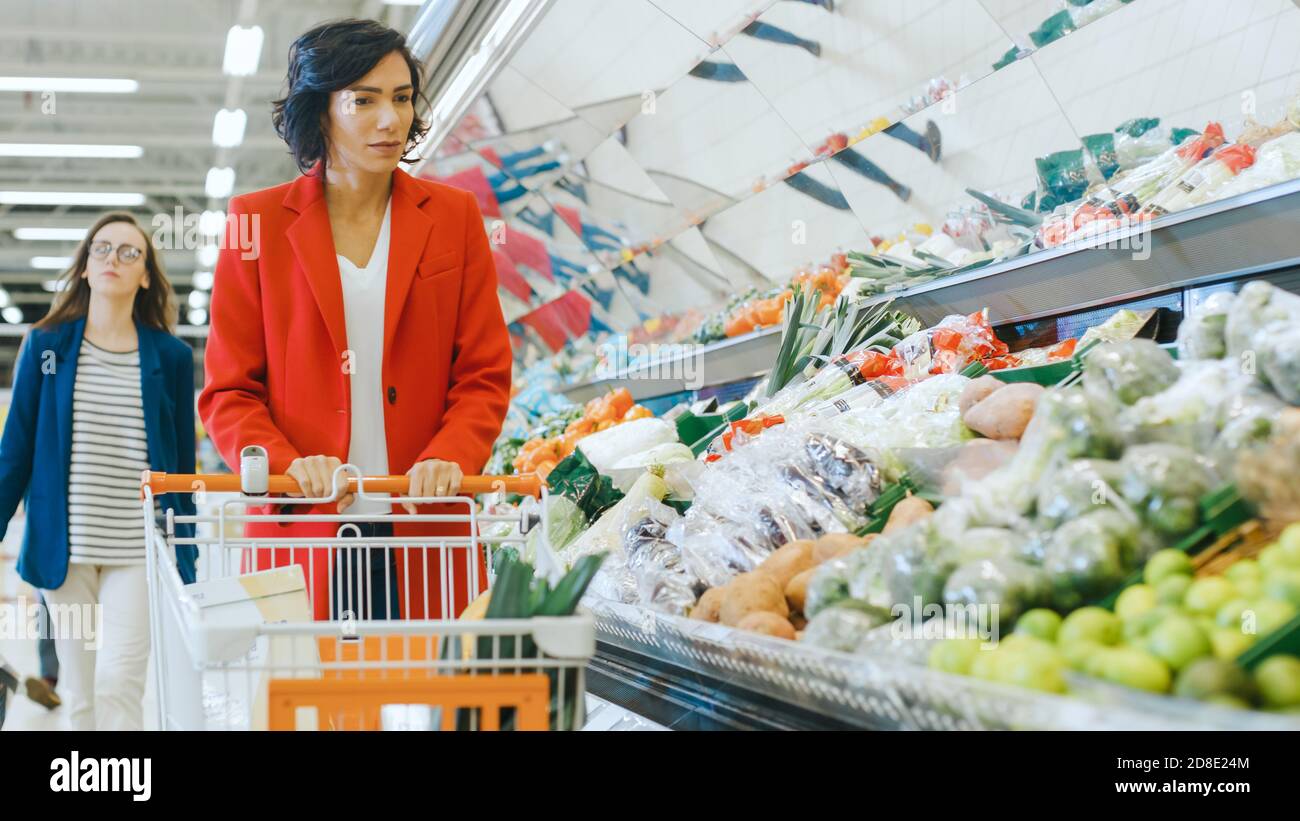 At the Supermarket: Shot of a Beautiful Young Woman Walking Through ...