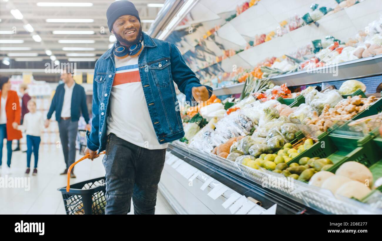 At the Supermarket: Happy Stylish Guy with Shopping Basket Dances ...