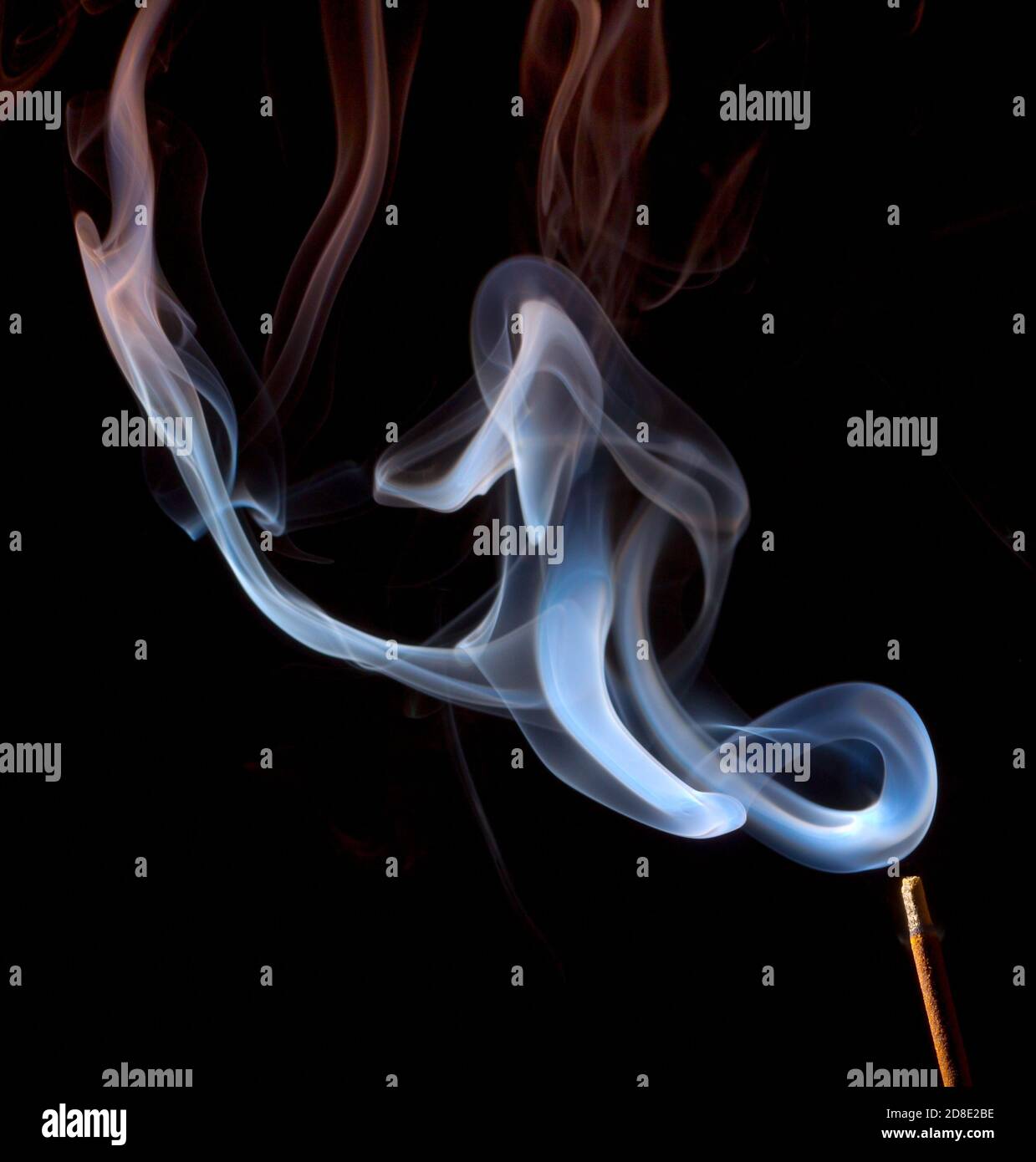 Multi color incense smoke on black Stock Photo - Alamy