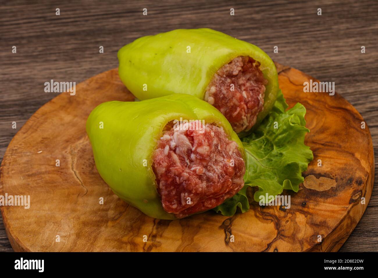 Raw stuffed green bell pepper with meat Stock Photo - Alamy