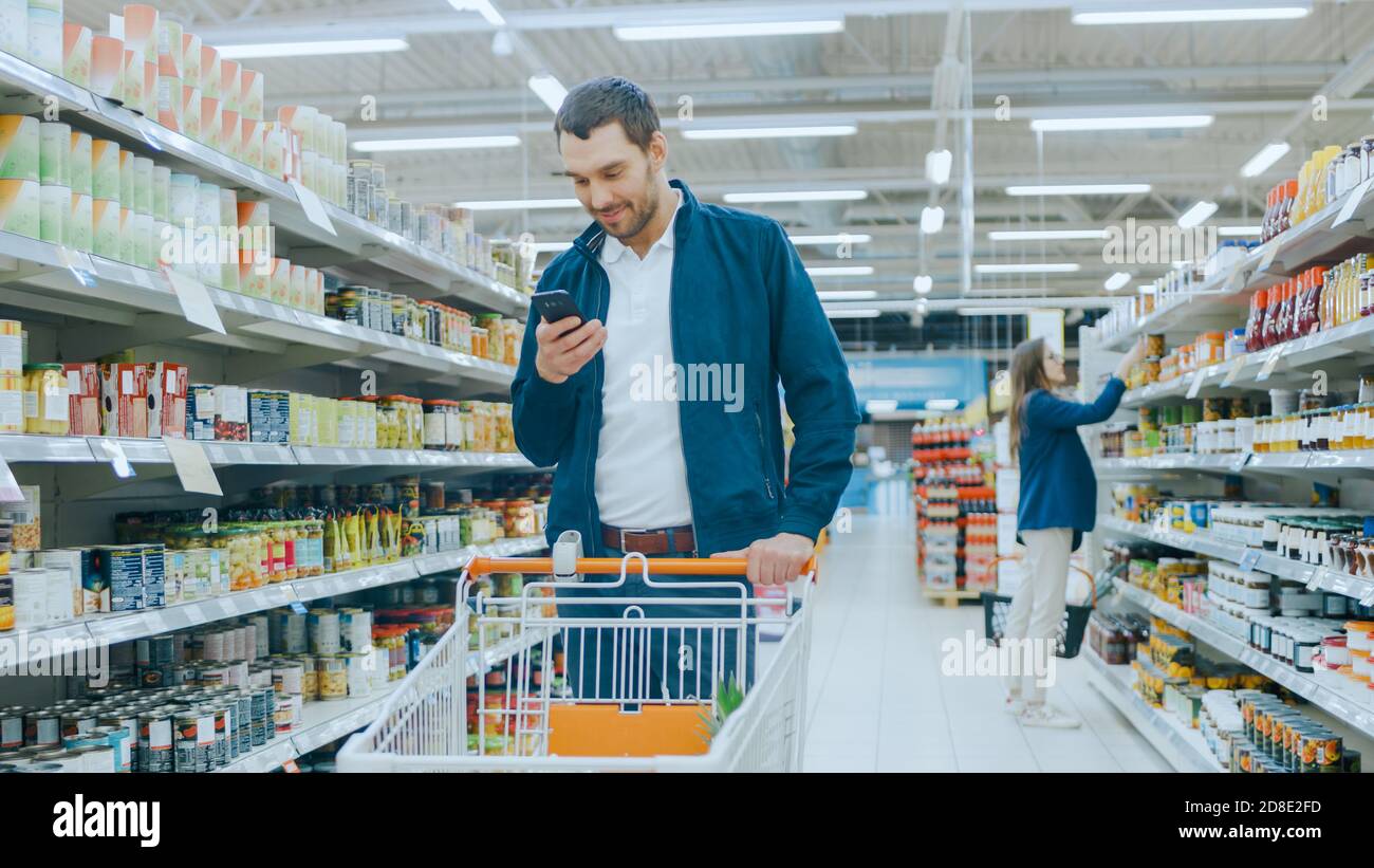 Supermarket man buying items hi-res stock photography and images - Alamy