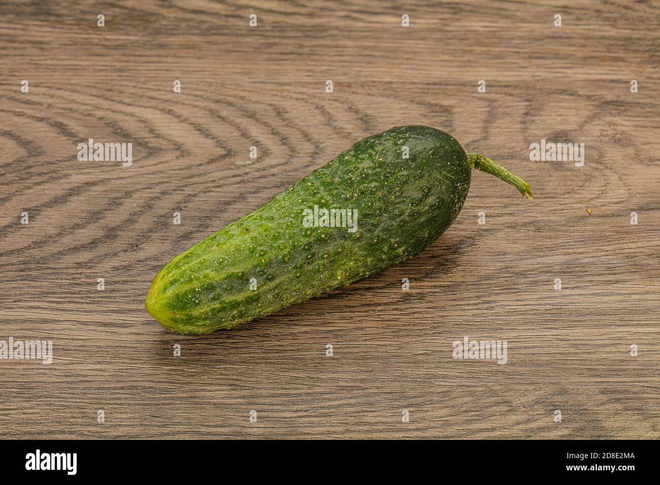 Green ripe fresh one cucumber over background Stock Photo - Alamy
