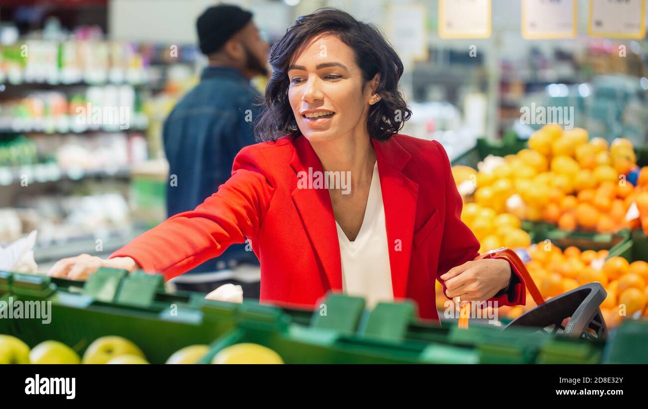 At the Supermarket: Portrait of the Beautiful Smiling Woman Choosing ...
