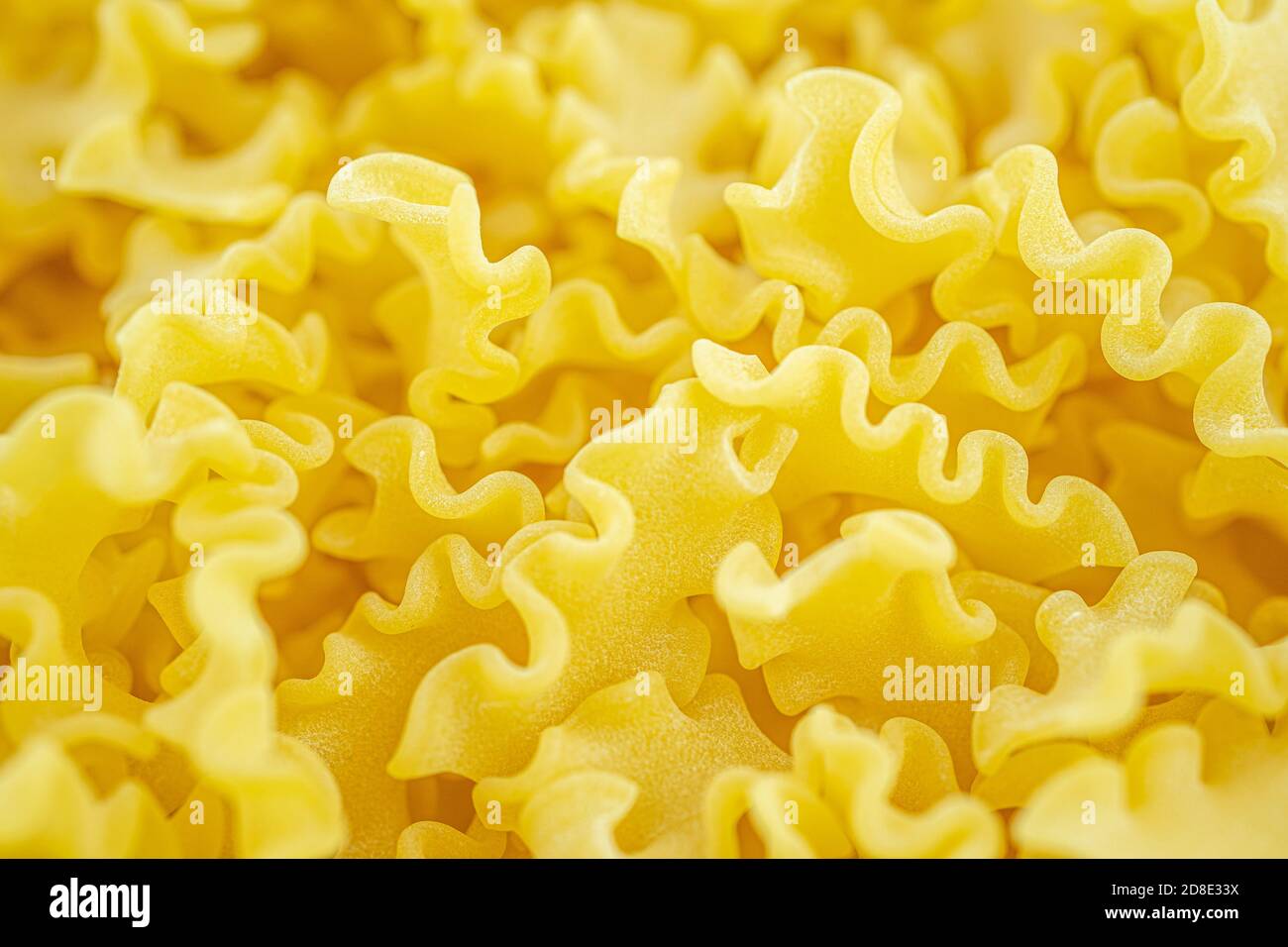 Italian dry wavy pasta background. Healthy traditional food. Top view ...