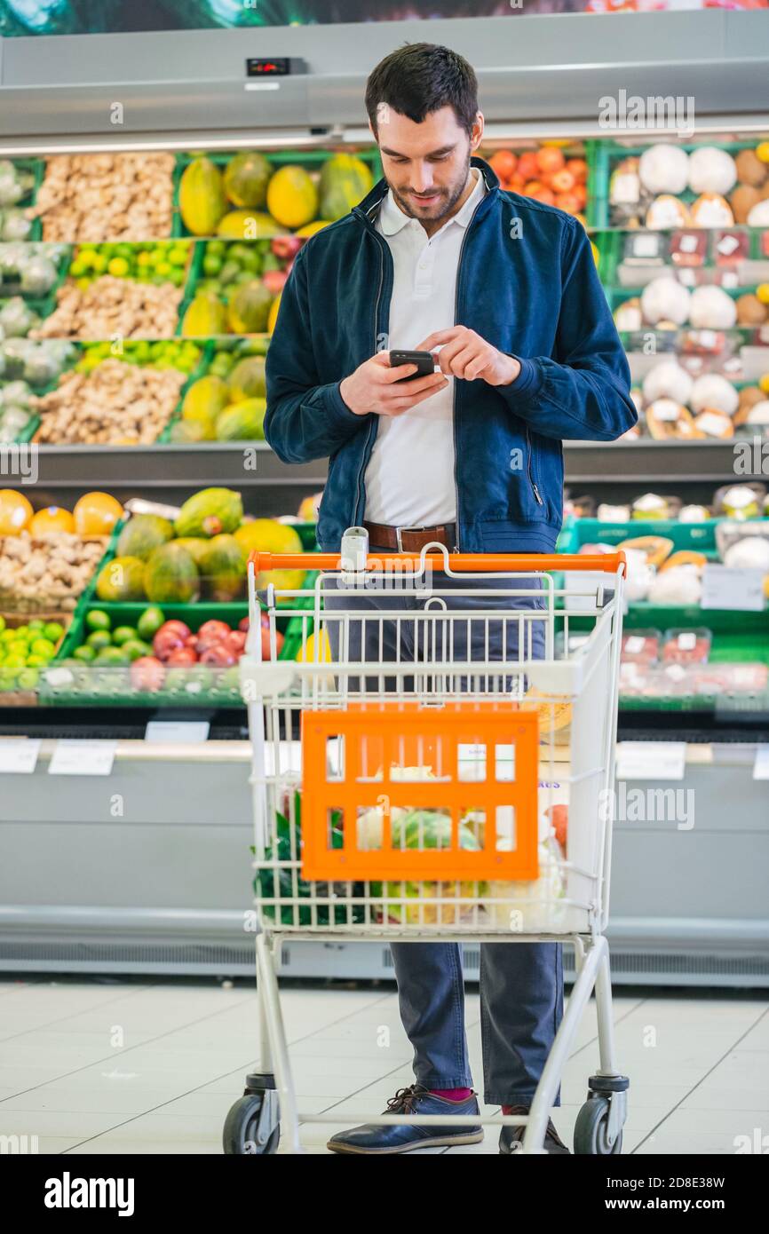 Pushing trolley side view goods hi-res stock photography and images - Alamy