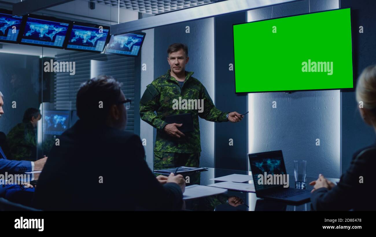 High-Ranking Military Man holds a Briefing to a Team of Government ...