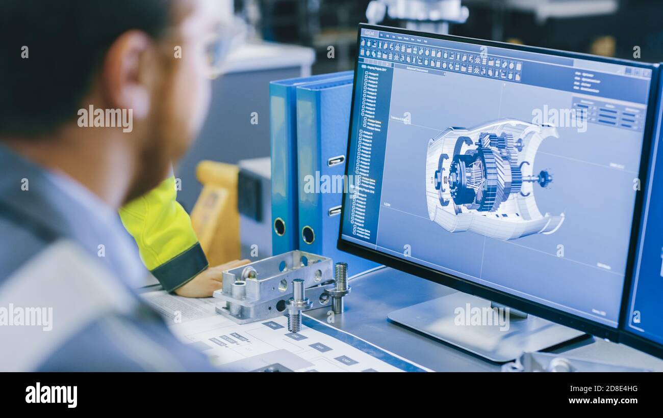 Close-up Back View of the Mechanical Engineer Designing 3D Engine Model ...