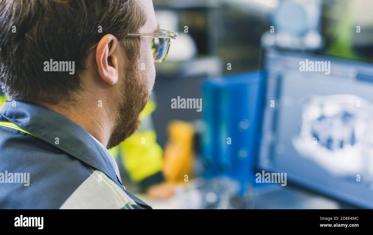 Close-up Back View of the Mechanical Engineer Designing 3D Engine Model ...