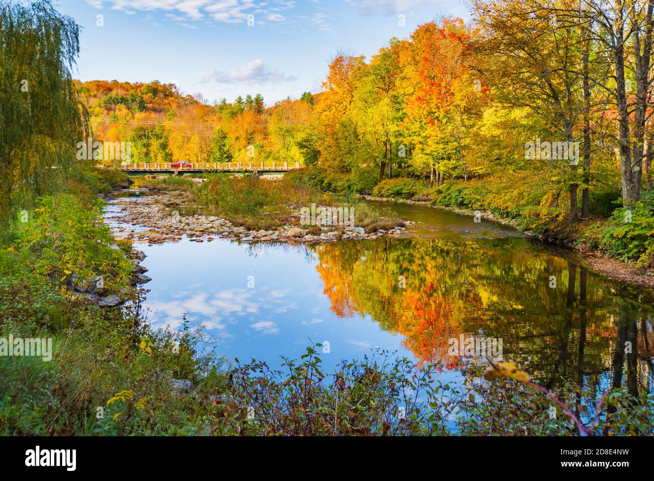 trees in beautiful fall colors reflected in quiet river stream Stock ...