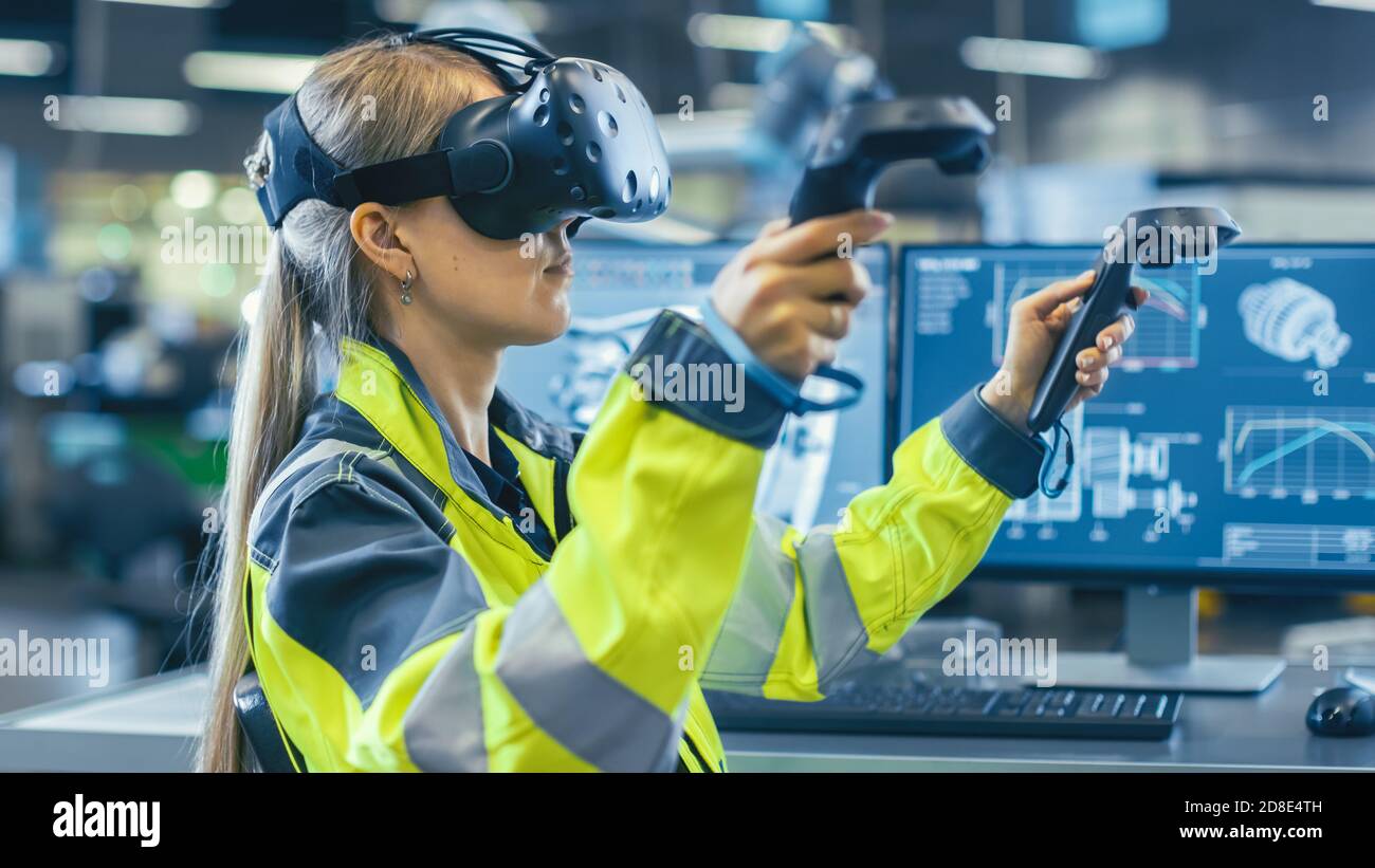 Female Industrial Engineer Wearing Virtual Reality Headset and Holding ...