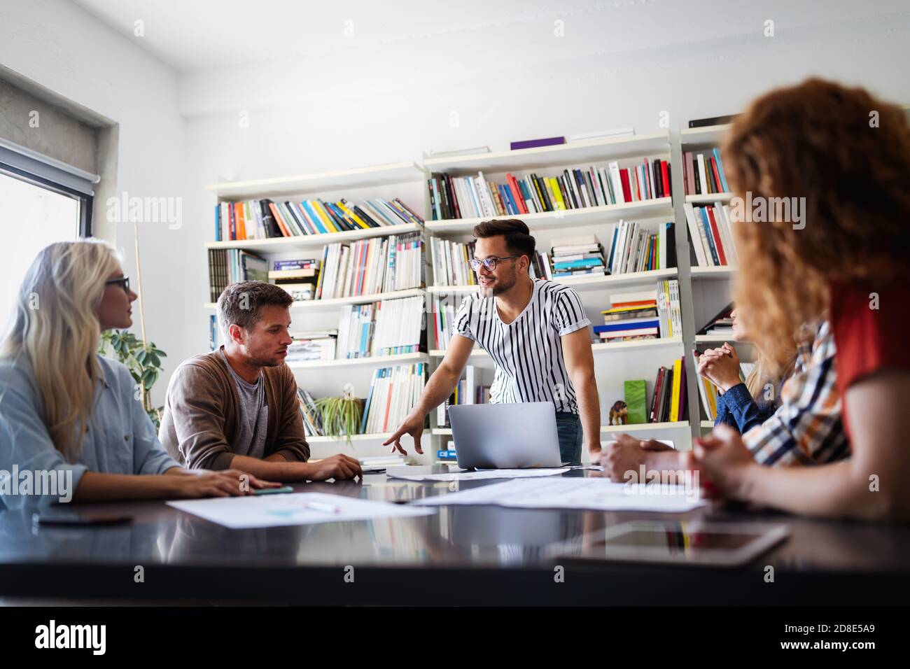 Successful group of designers, business people at work in office Stock ...