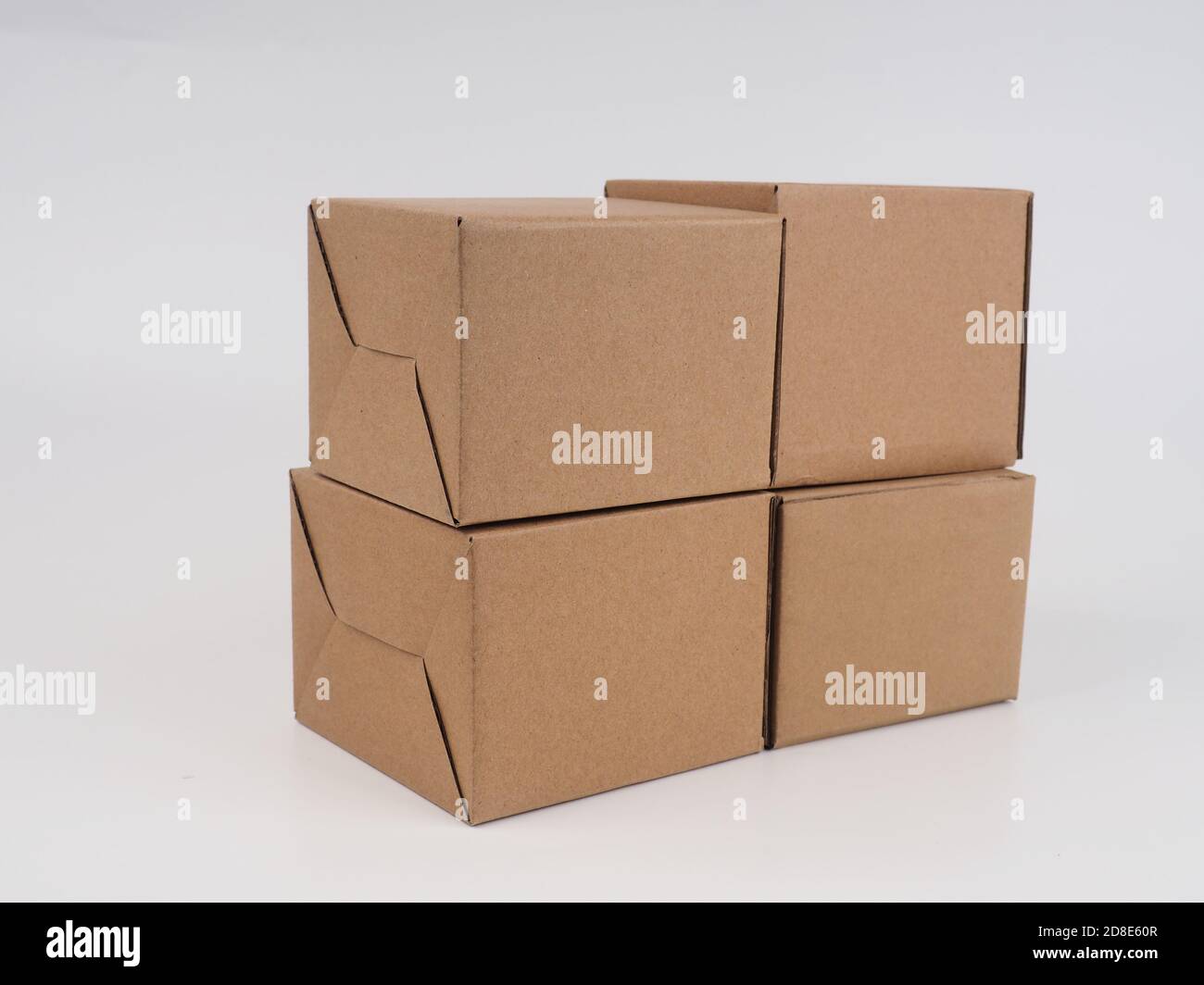 several cardboard boxes. Cardboard Boxes Stacked Against White ...