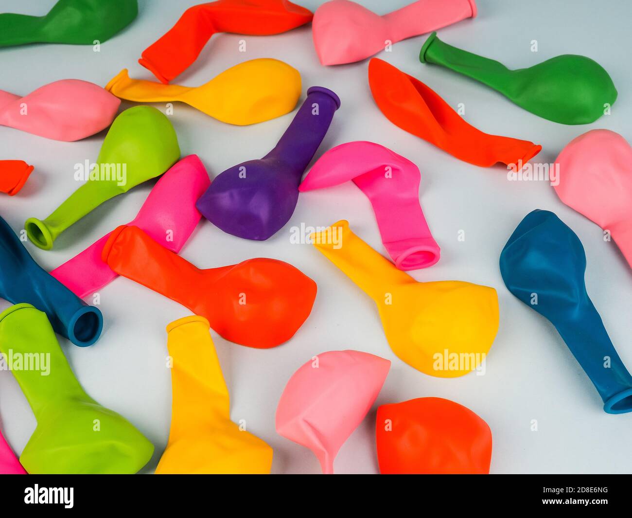 Deflated Balloons. Pile of multiple colorful deflated rubber air ...