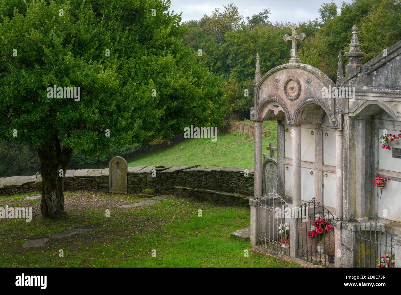 Elegant marble graves in an old rural cemetery in Galicia Stock Photo ...