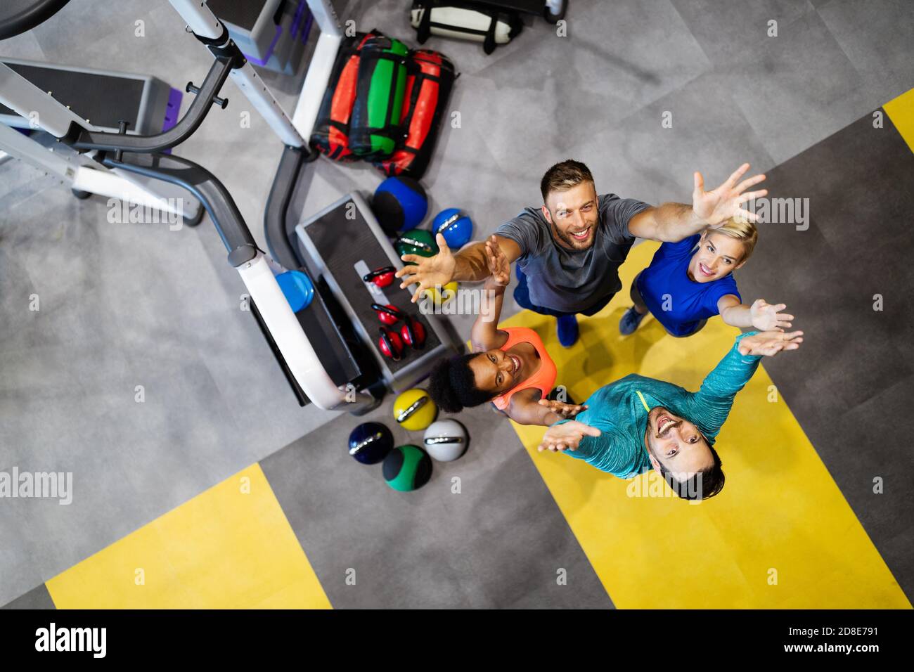 Fit people working out in fitness class at the gym Stock Photo - Alamy
