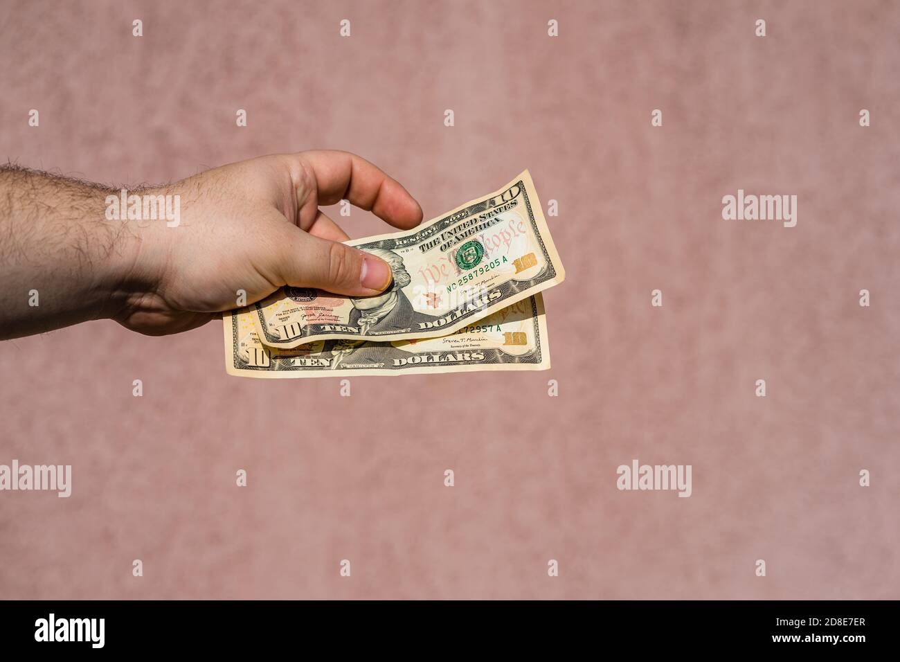 Hand holding showing dollars money and giving or receiving money like ...