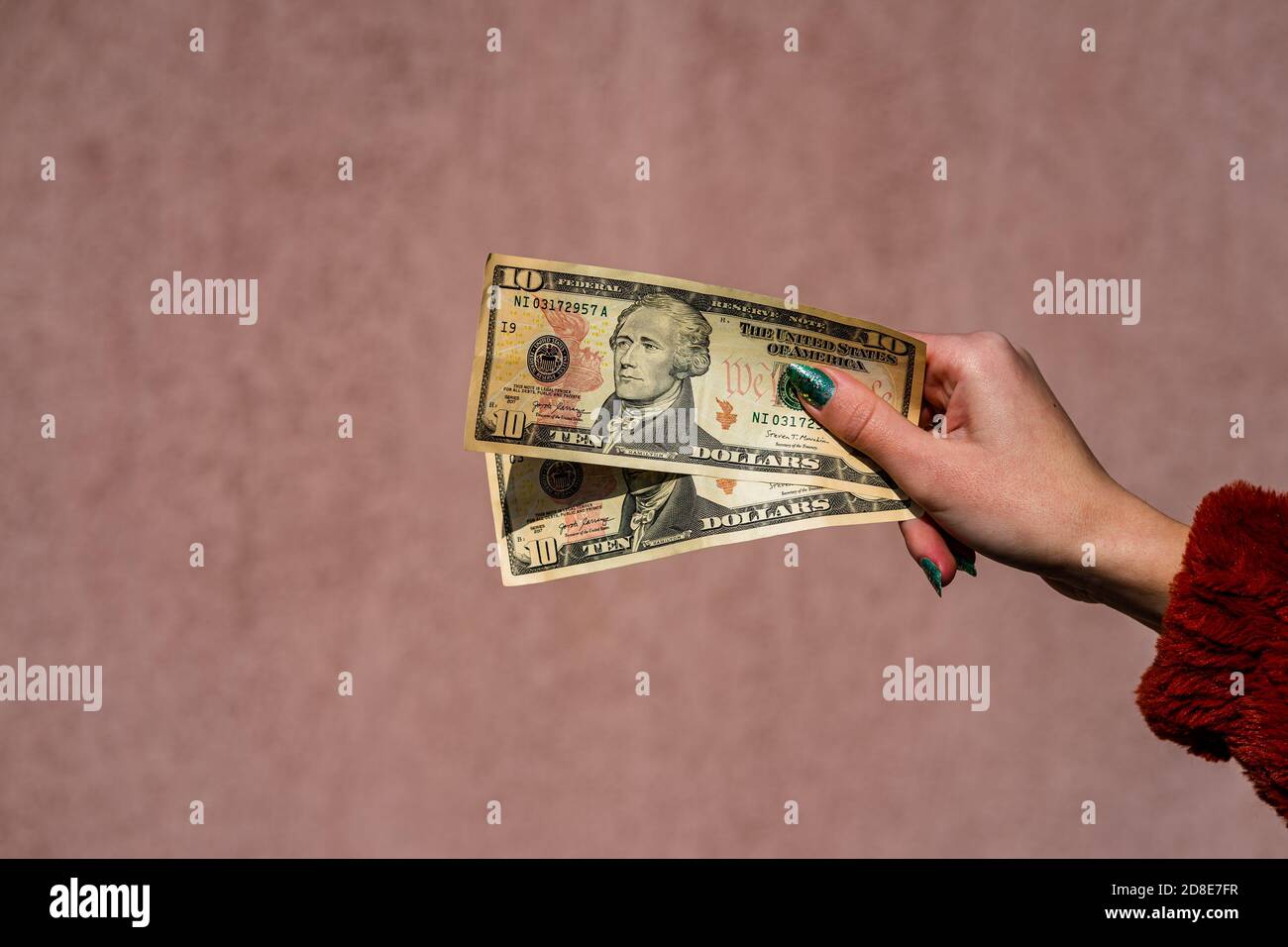 Hand holding showing dollars money and giving or receiving money like ...