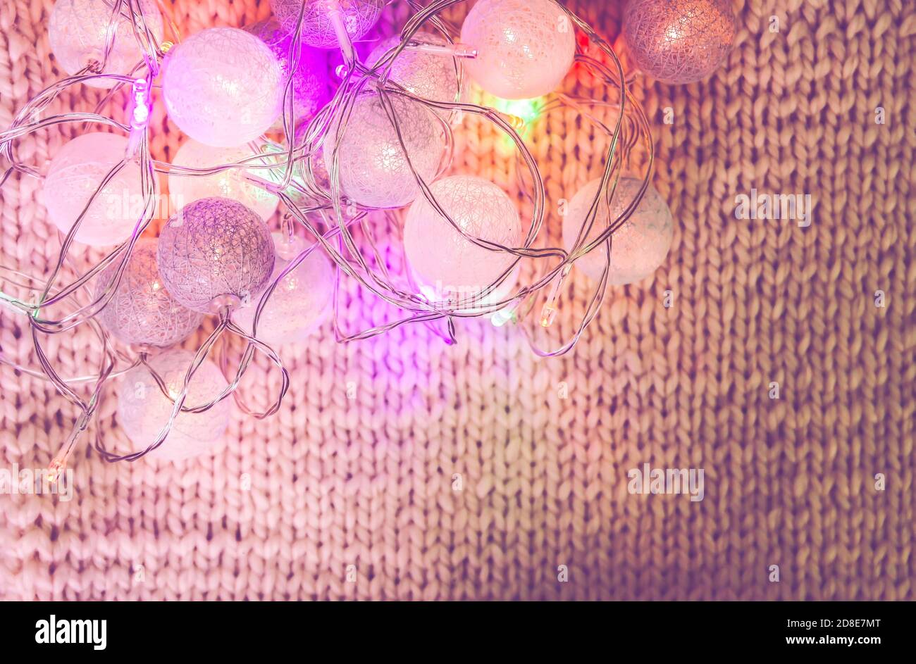 Christmas lights garland with round lanterns on knitted fabric ...