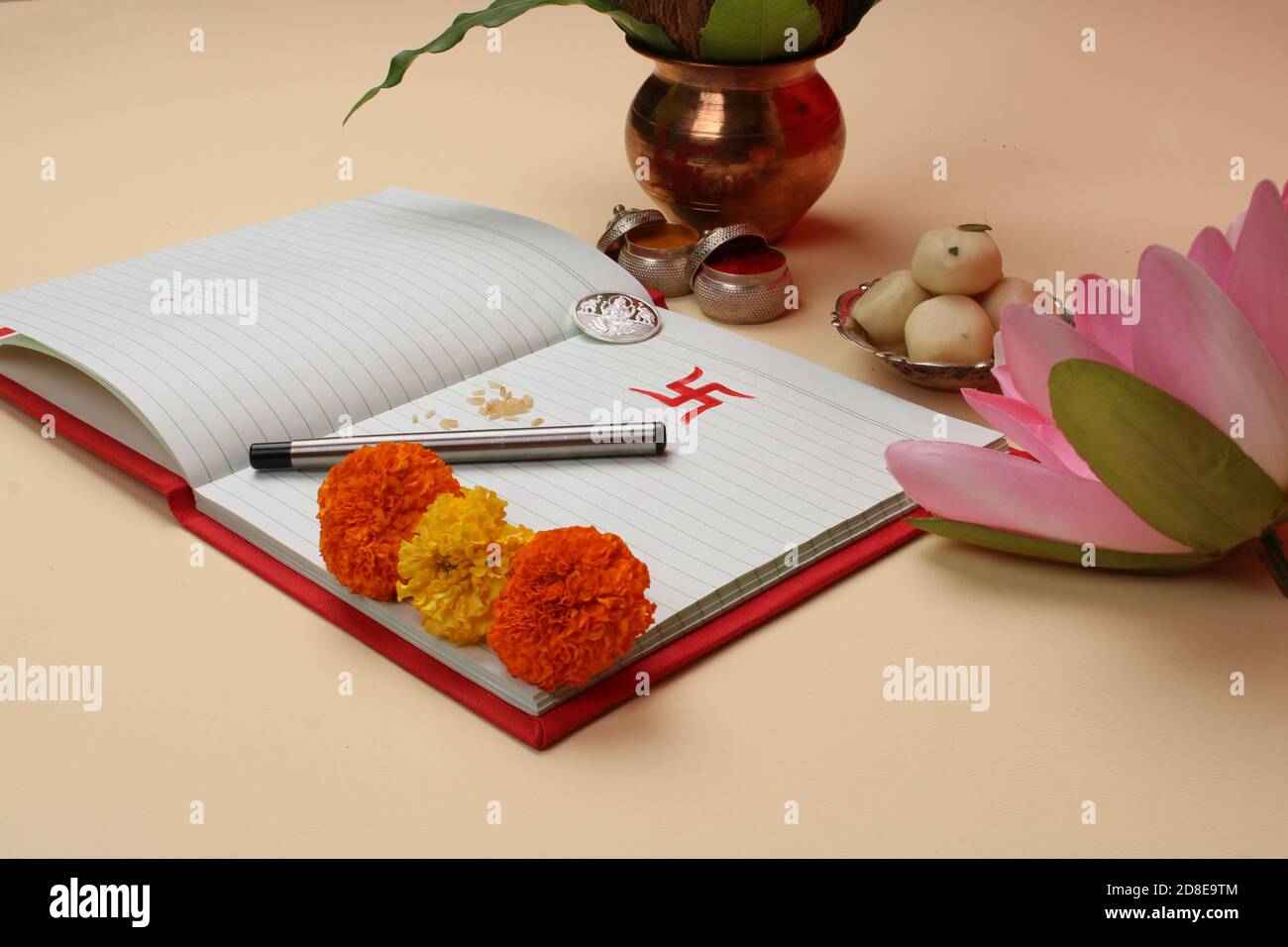Red accounting note book / bahi khata with copper kalash, sweets ...