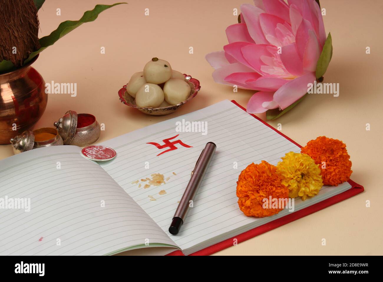 Red accounting note book / bahi khata with copper kalash, sweets ...