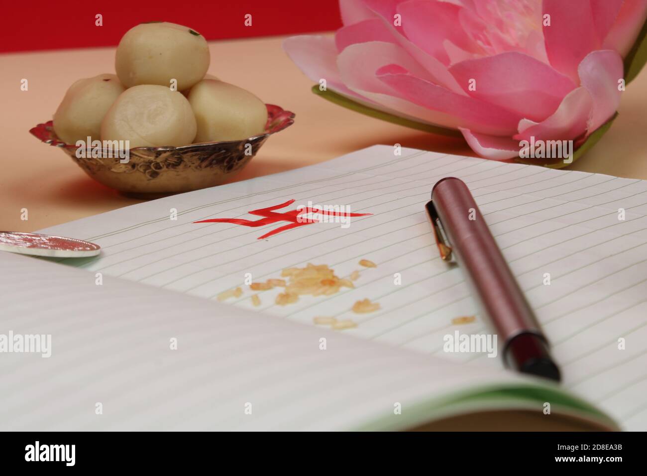 Red accounting note book / bahi khata with copper kalash, sweets ...