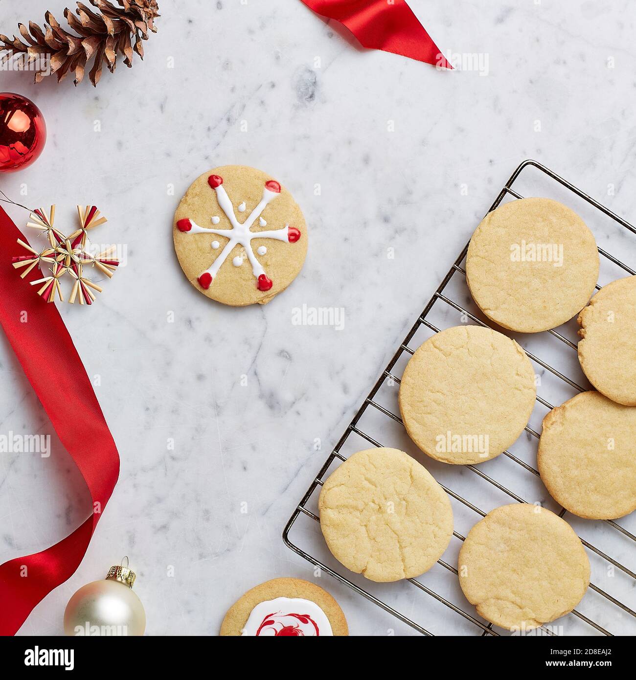 Holiday cookies on cooling rack with one decorated Stock Photo - Alamy