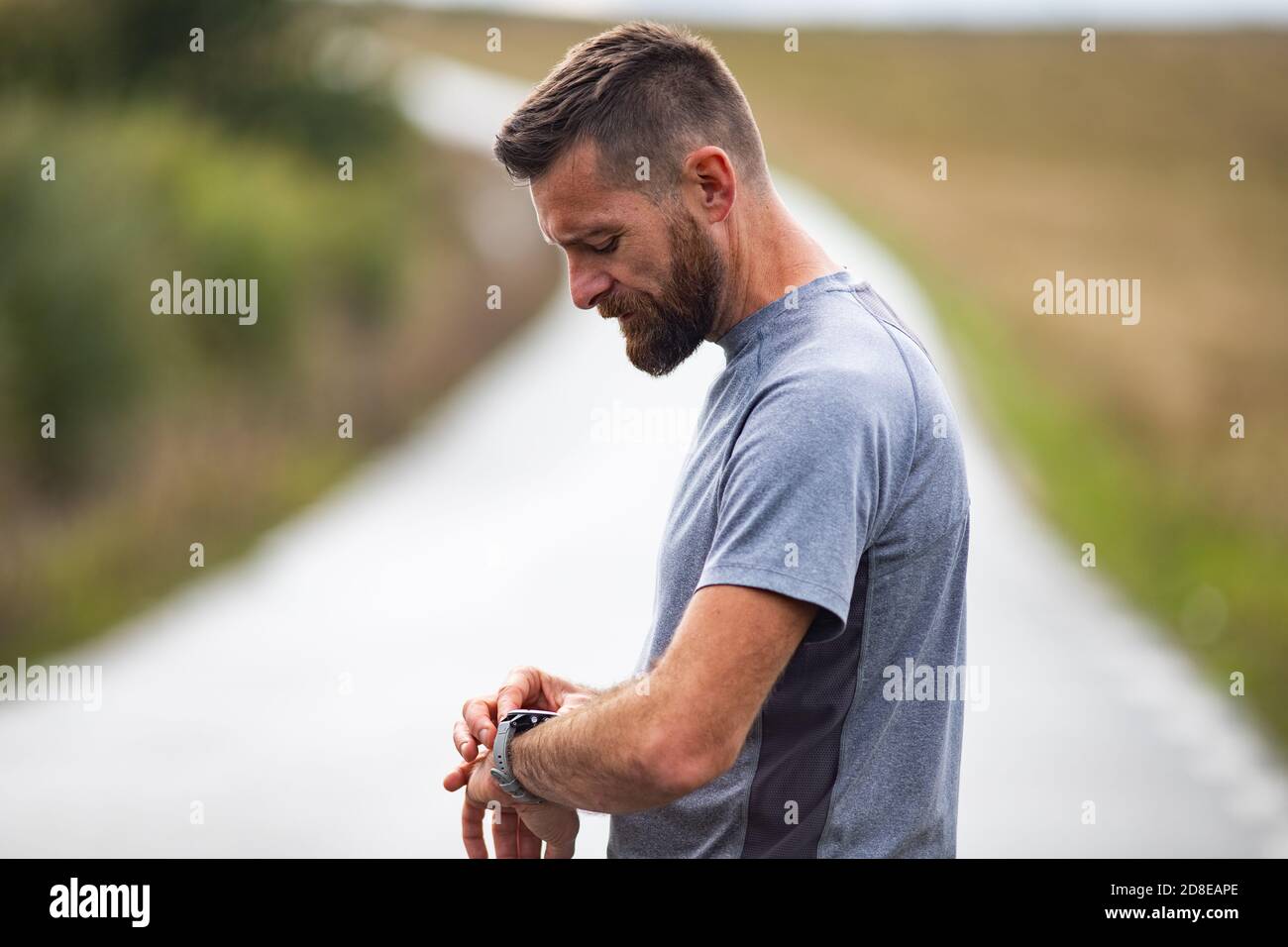 Man wearable device jogging hi-res stock photography and images - Alamy
