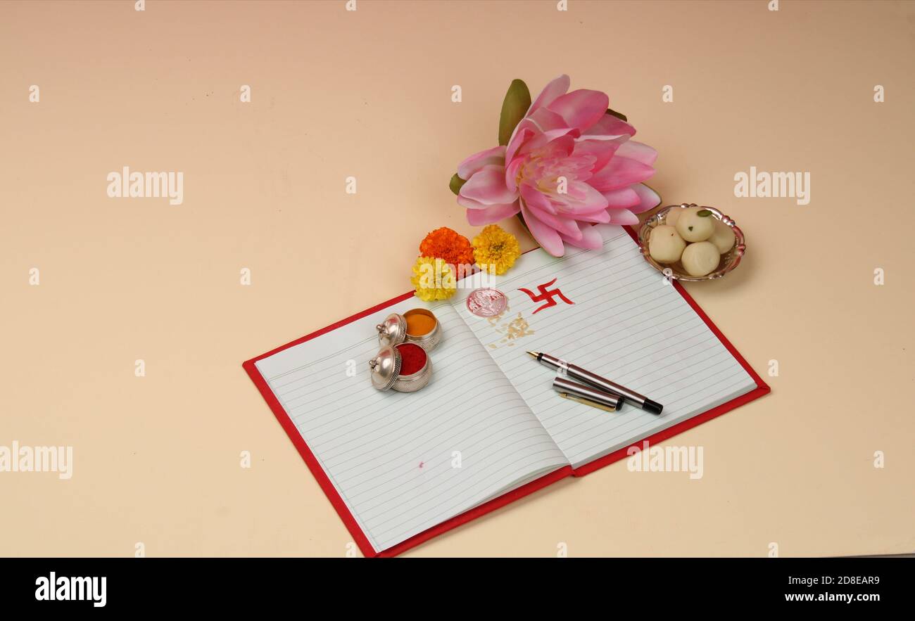 Red accounting note book / bahi khata with copper kalash, sweets ...