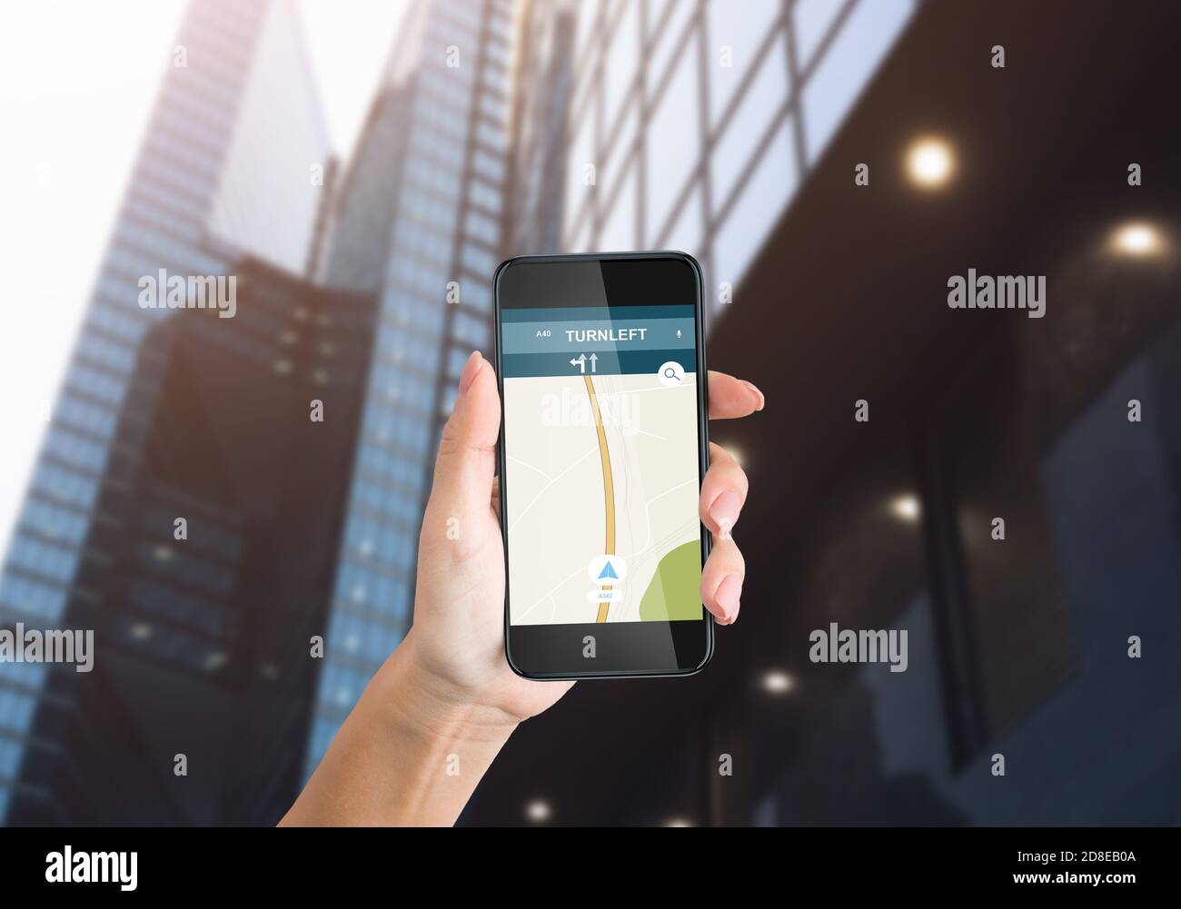 Hand Holding Phone With Navigation App Walking In Urban Area Stock ...