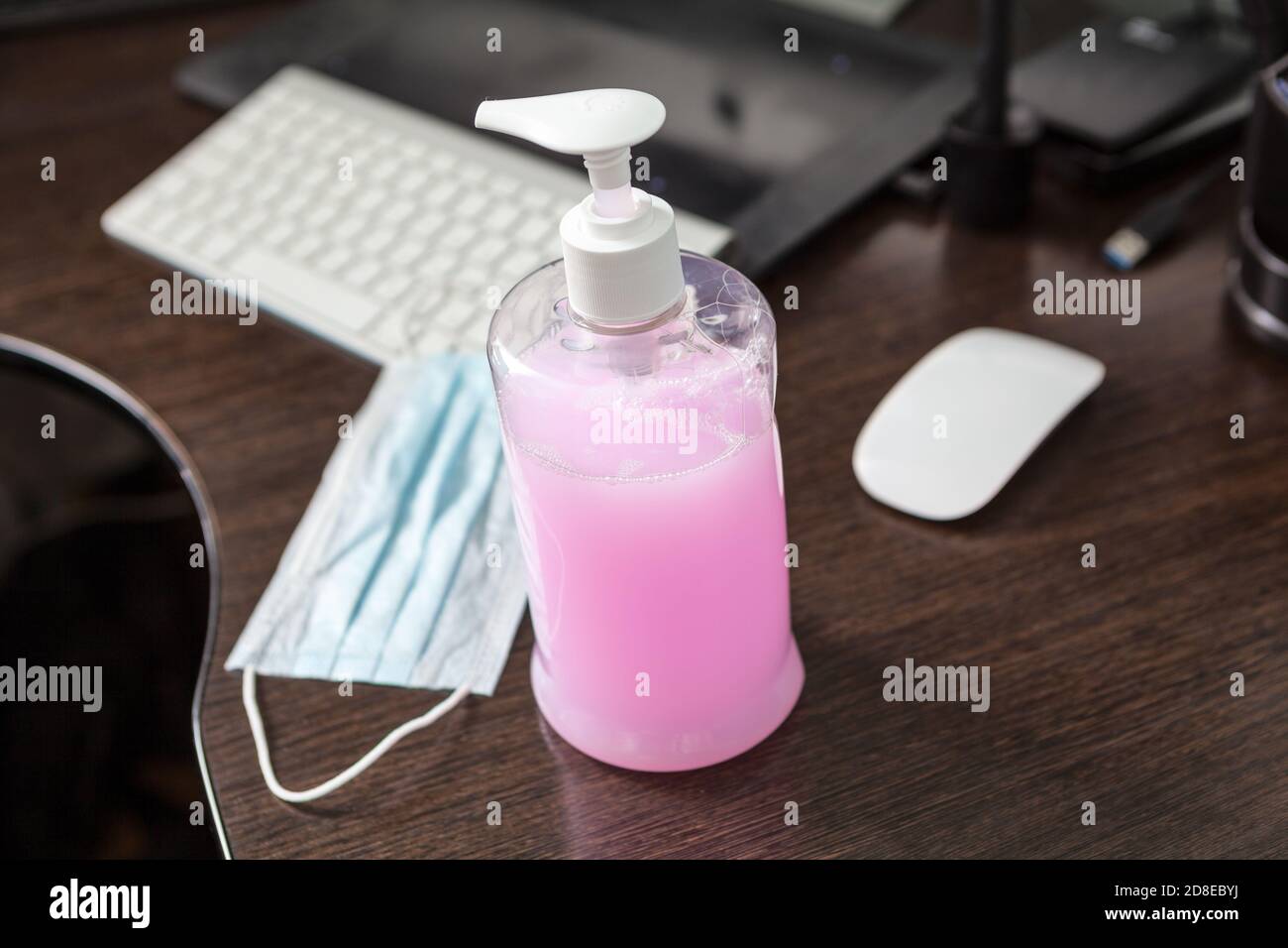 Hygiene is on a workspace, sanitizer for computer mouse and keyboard ...