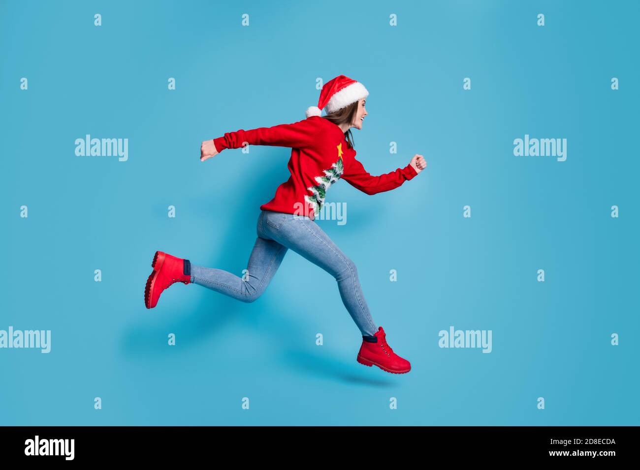 Photo portrait of girl running jumping up isolated on pastel light blue ...