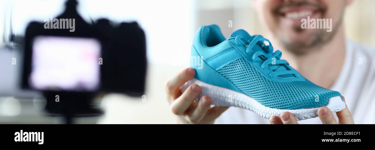 Happy guy present shoes Stock Photo - Alamy