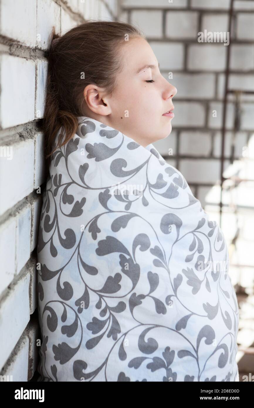 Beautiful teenage girl sleep securely with wrapped blanket, one ...
