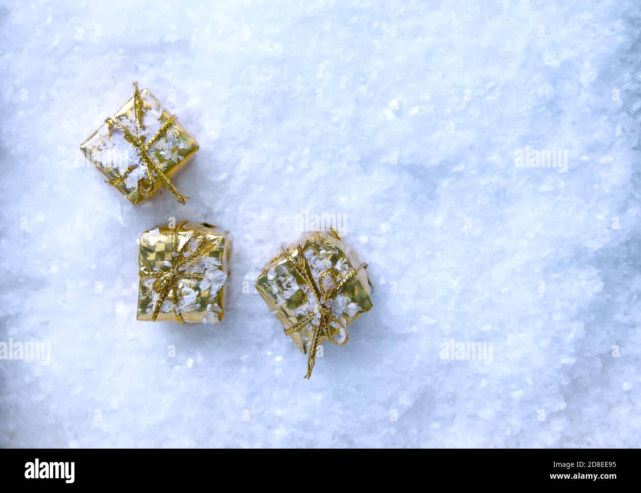 Small colorful gift boxes on fluffy snow. Winter design elements Stock ...