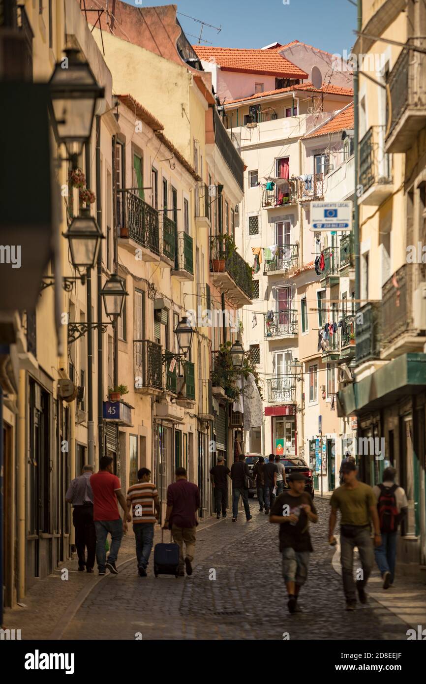 Narrow streets and beautiful architecture in the Alfama neighborhood of ...