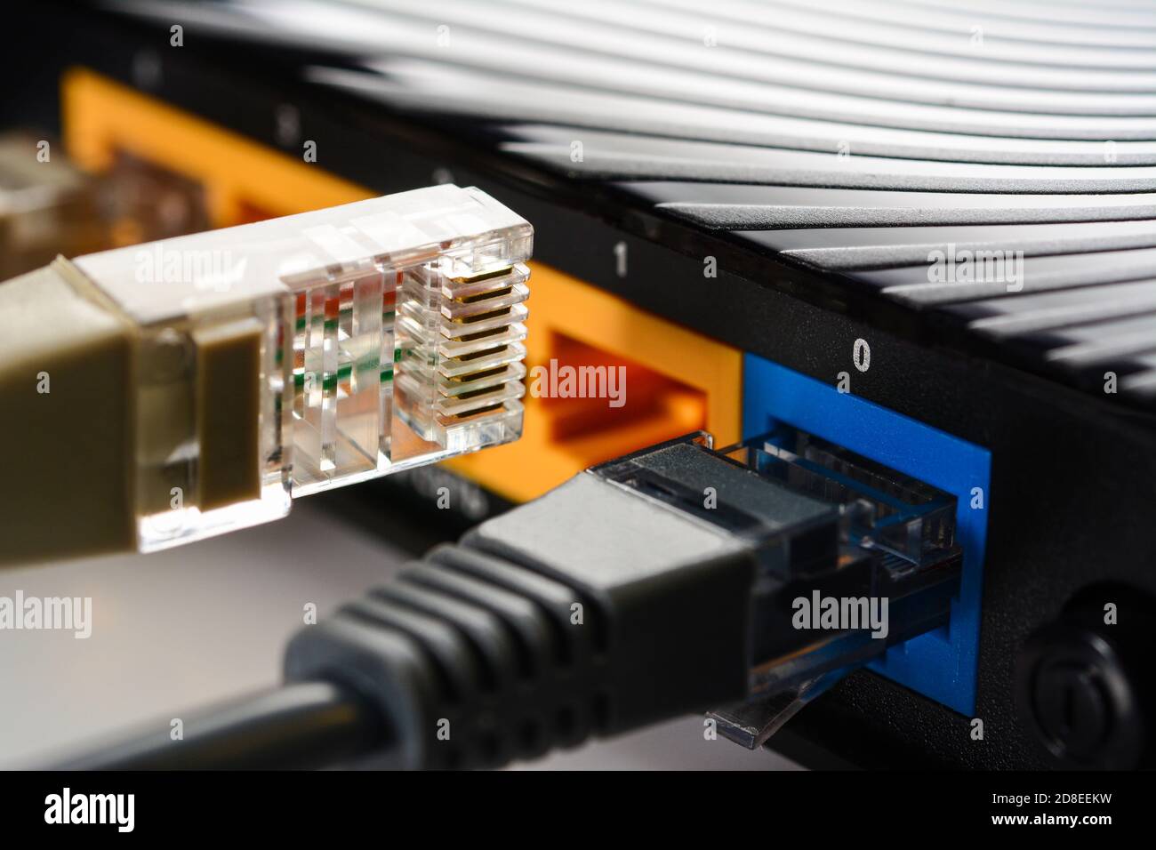 Home internet router with three cables with the rj-45 connectors ...