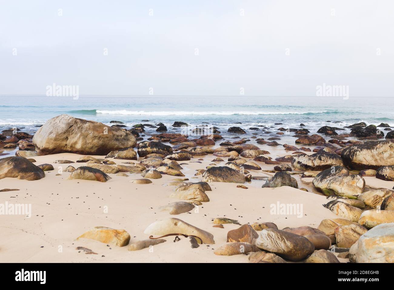 Magnificent view of a calm sea and a beach with yellow sand and quite ...