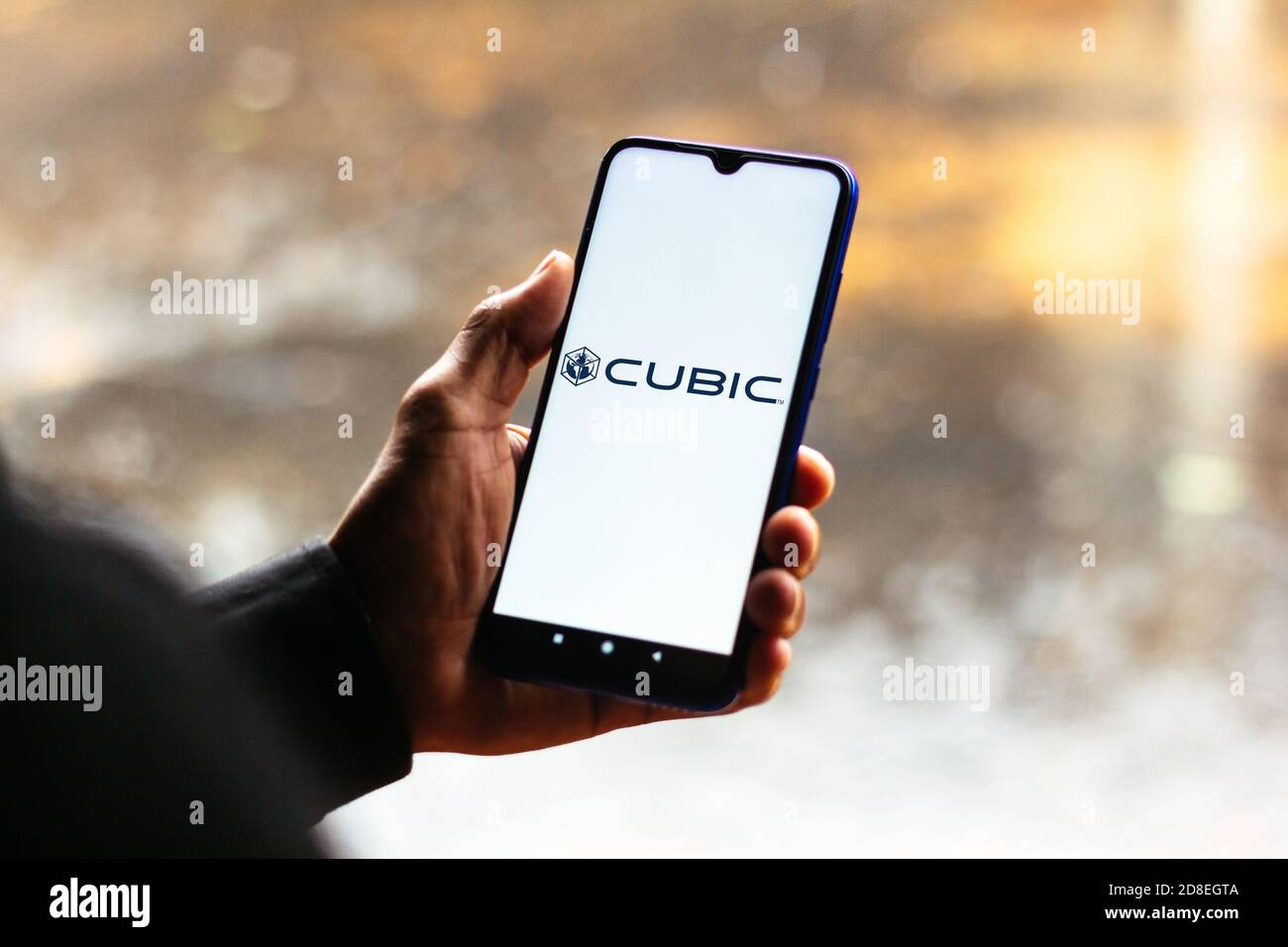 In this photo illustration the Cubic Corporation logo seen displayed on ...