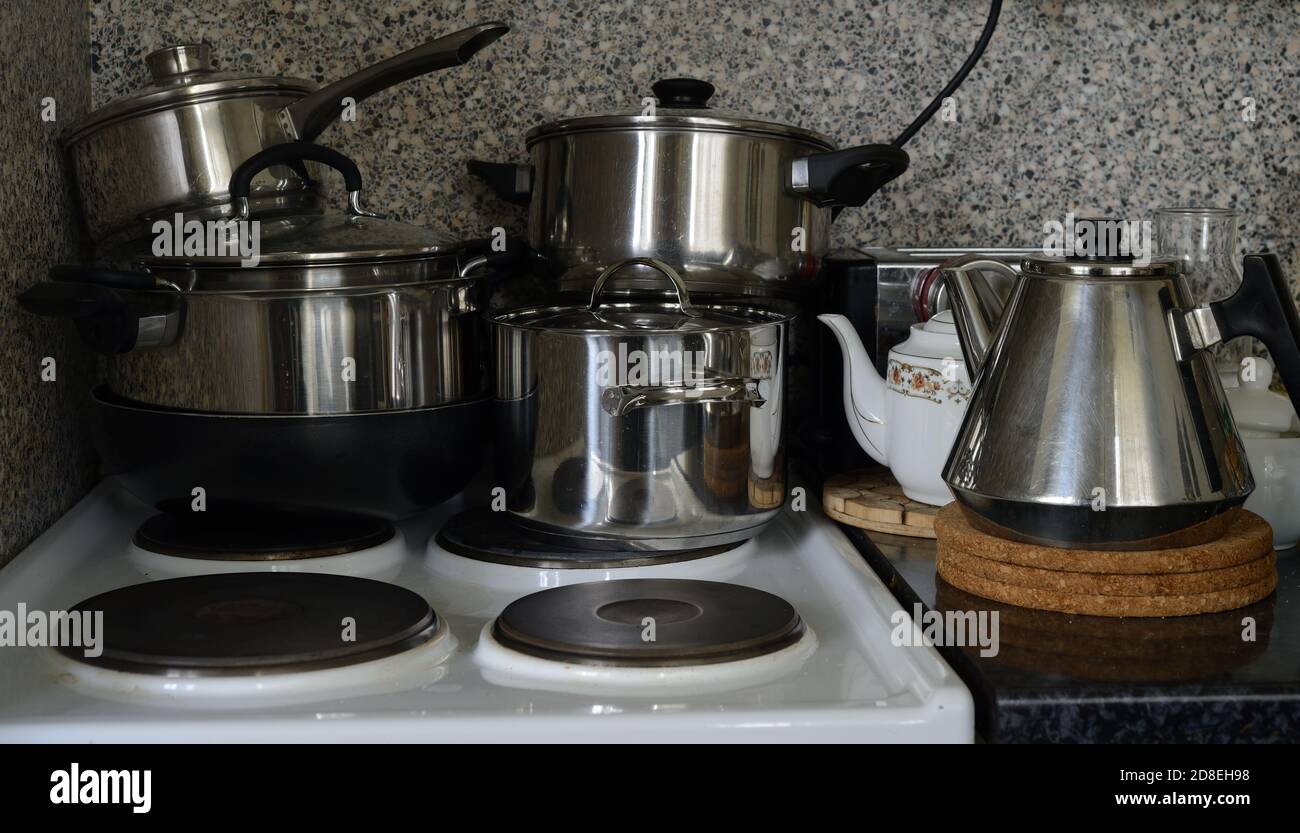 various dishes in the kitchen and a stove Stock Photo - Alamy