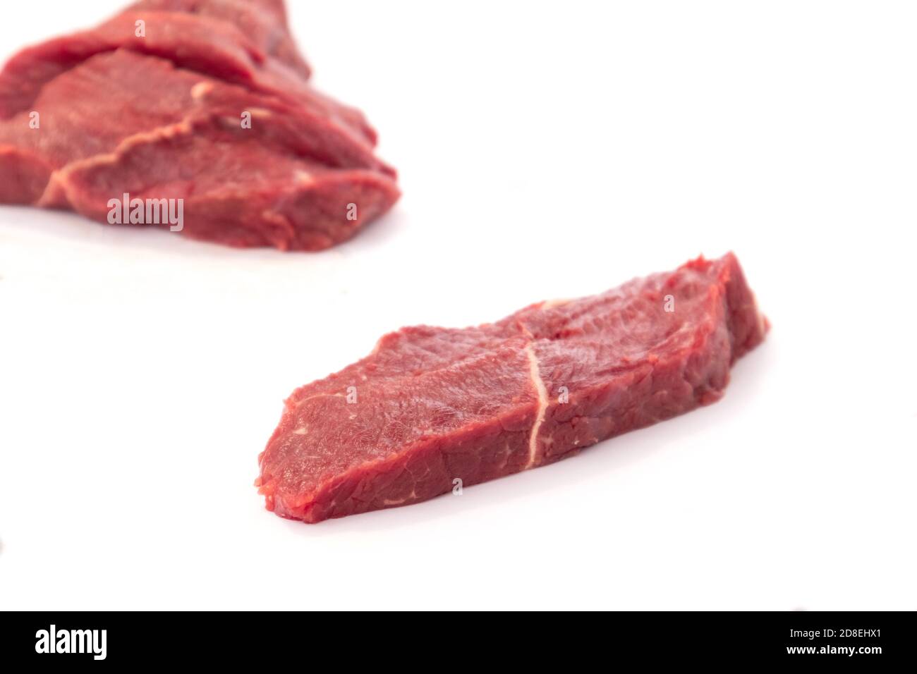Fresh raw beef steak isolated on white background. Close up raw meat ...