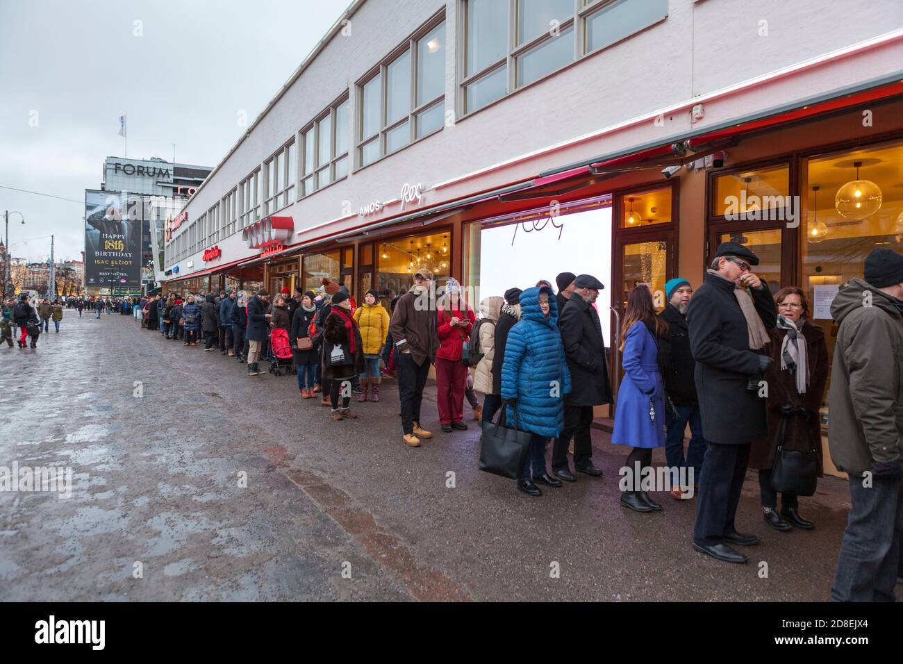 HELSINKI, FINLAND-CIRCA DEC, 2018: Long line from people is next to ...