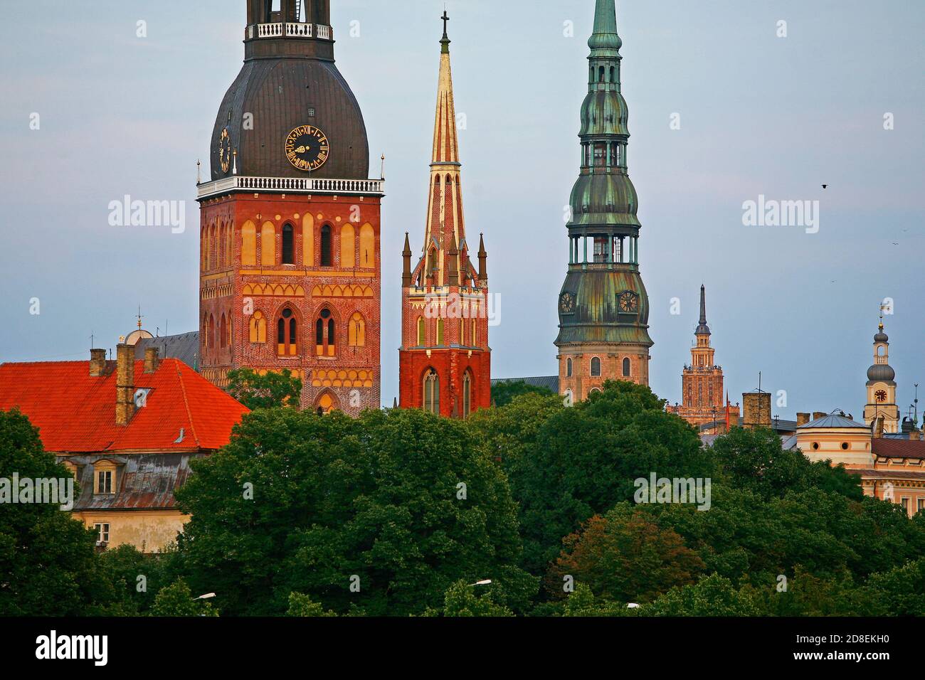 Five high towers above the tops of the trees Stock Photo - Alamy