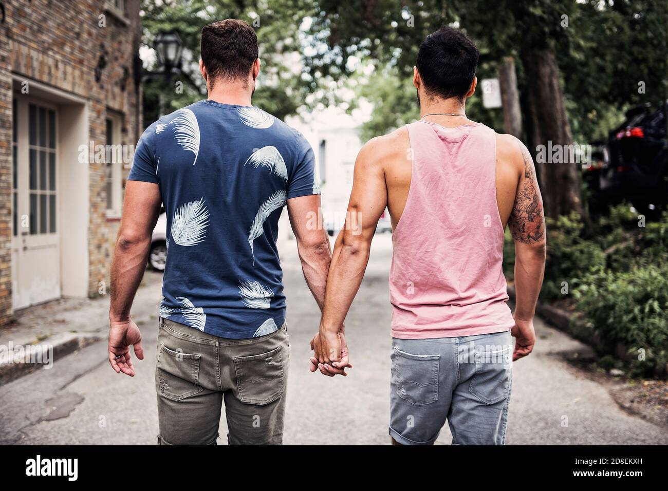A Portrait Of A Happy Gay Couple Outdoors In Urban Background Stock