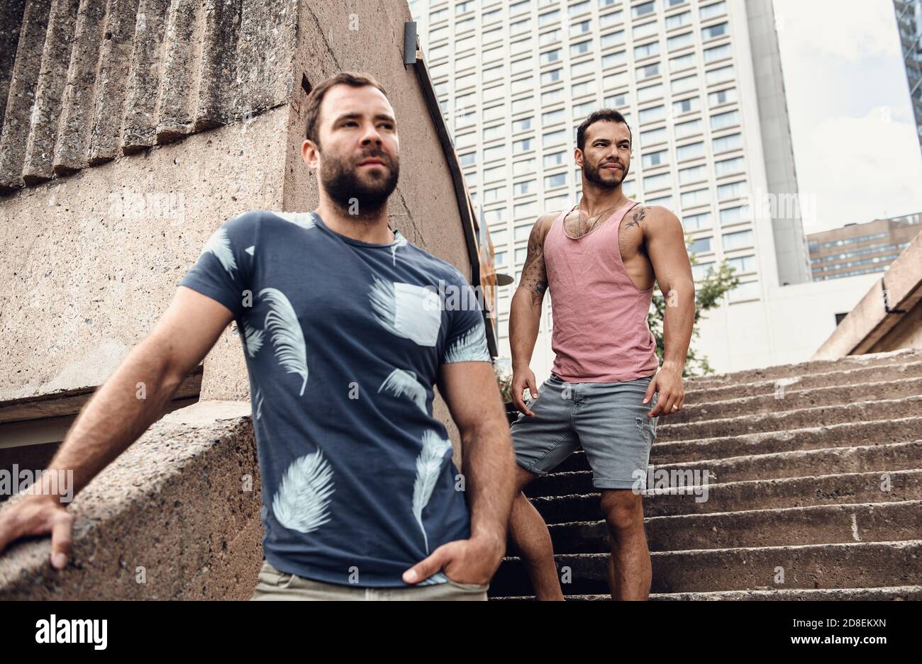 A Portrait Of A Happy Gay Couple Outdoors In Urban Background Stock