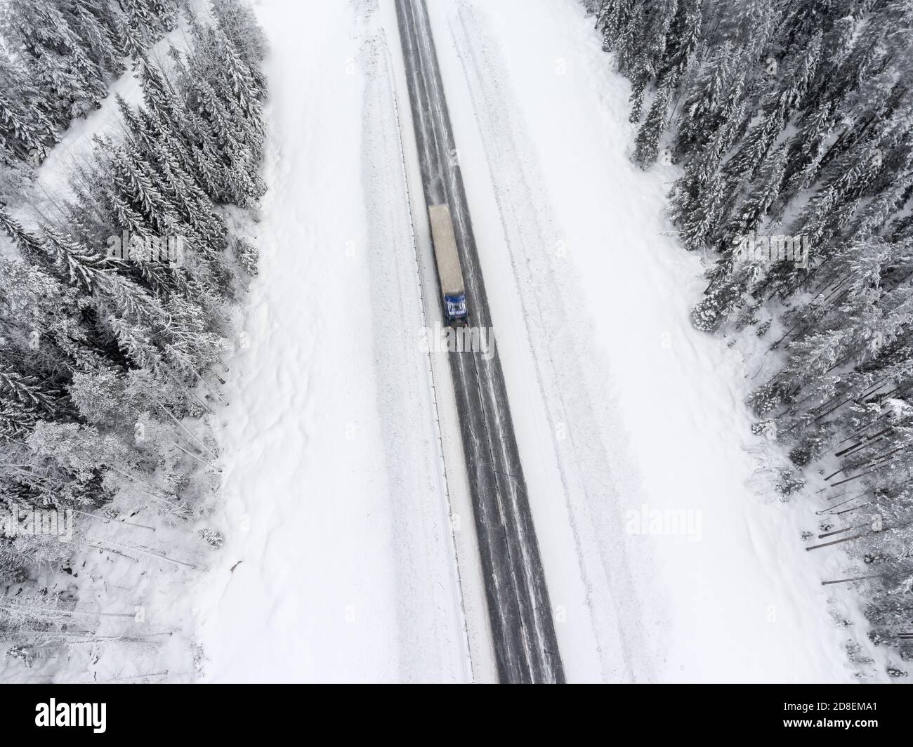 Semitrailer track driving through the blizzard on wintry highway, top ...