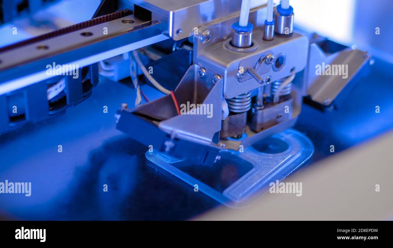 Three dimensional printing machine printing 3D plastic model at modern ...