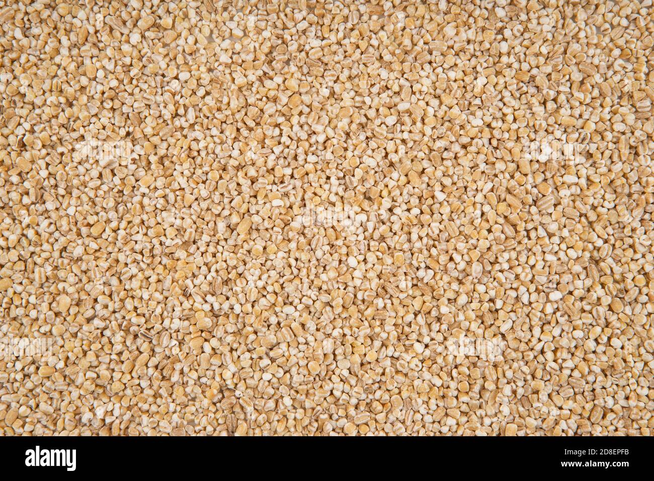 The texture of barley groats - top view and close-up on the grains of ...