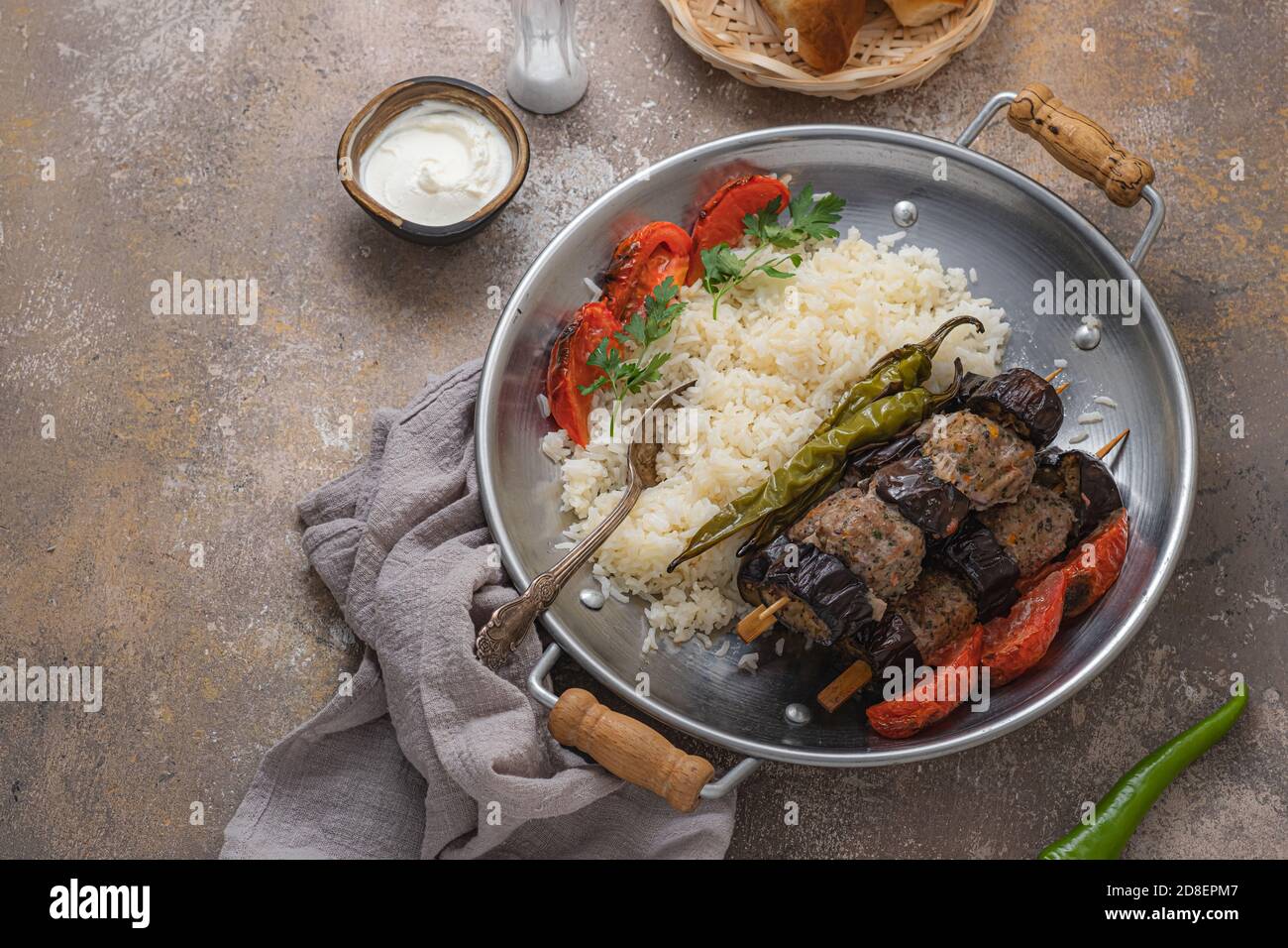 Urfa kebab or patlican kebab on skewers with rice, copy space Stock ...