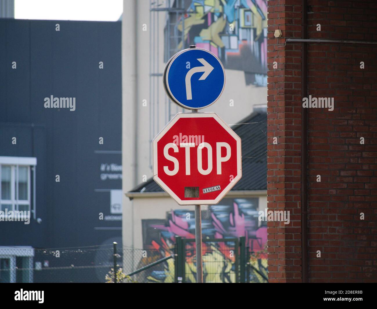 A Stop sign along with a Right Turn sign Stock Photo - Alamy